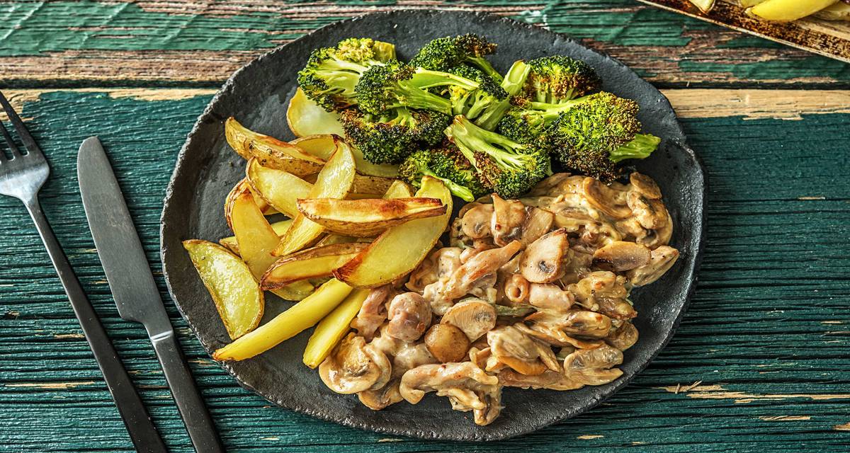 Kippendij in romige cheddar-biersaus Recept | HelloFresh