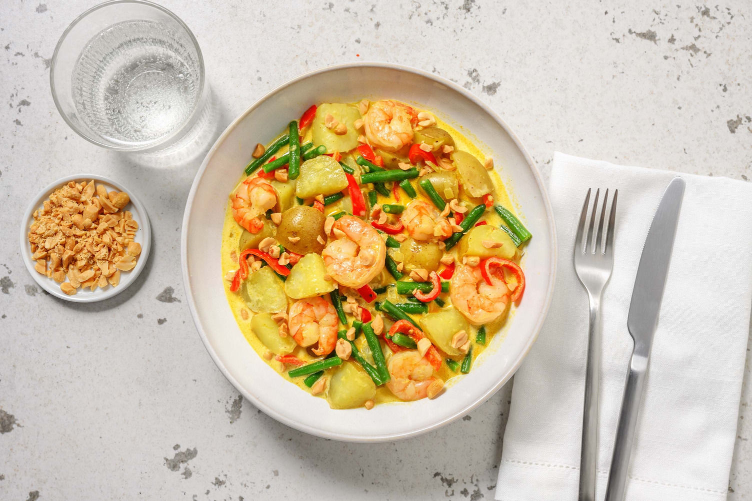 Gele curry met garnalen en pinda's Recept | HelloFresh