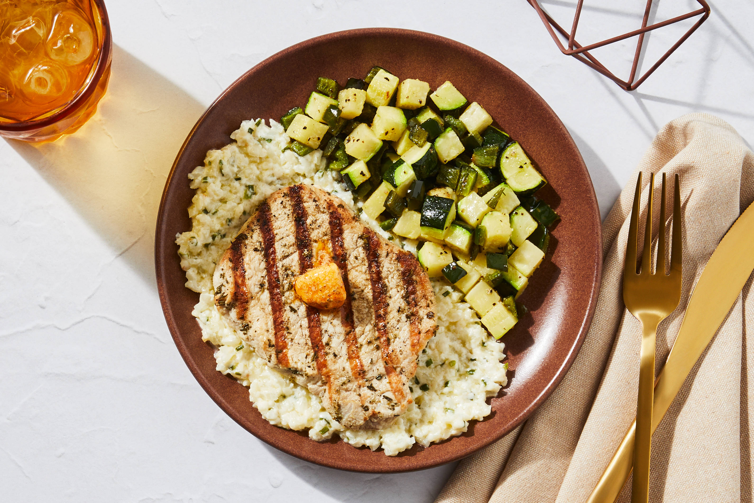 Grilled Pork Chop & Smoked Cheddar Cauli Grits with BBQ Butter, Roasted ...