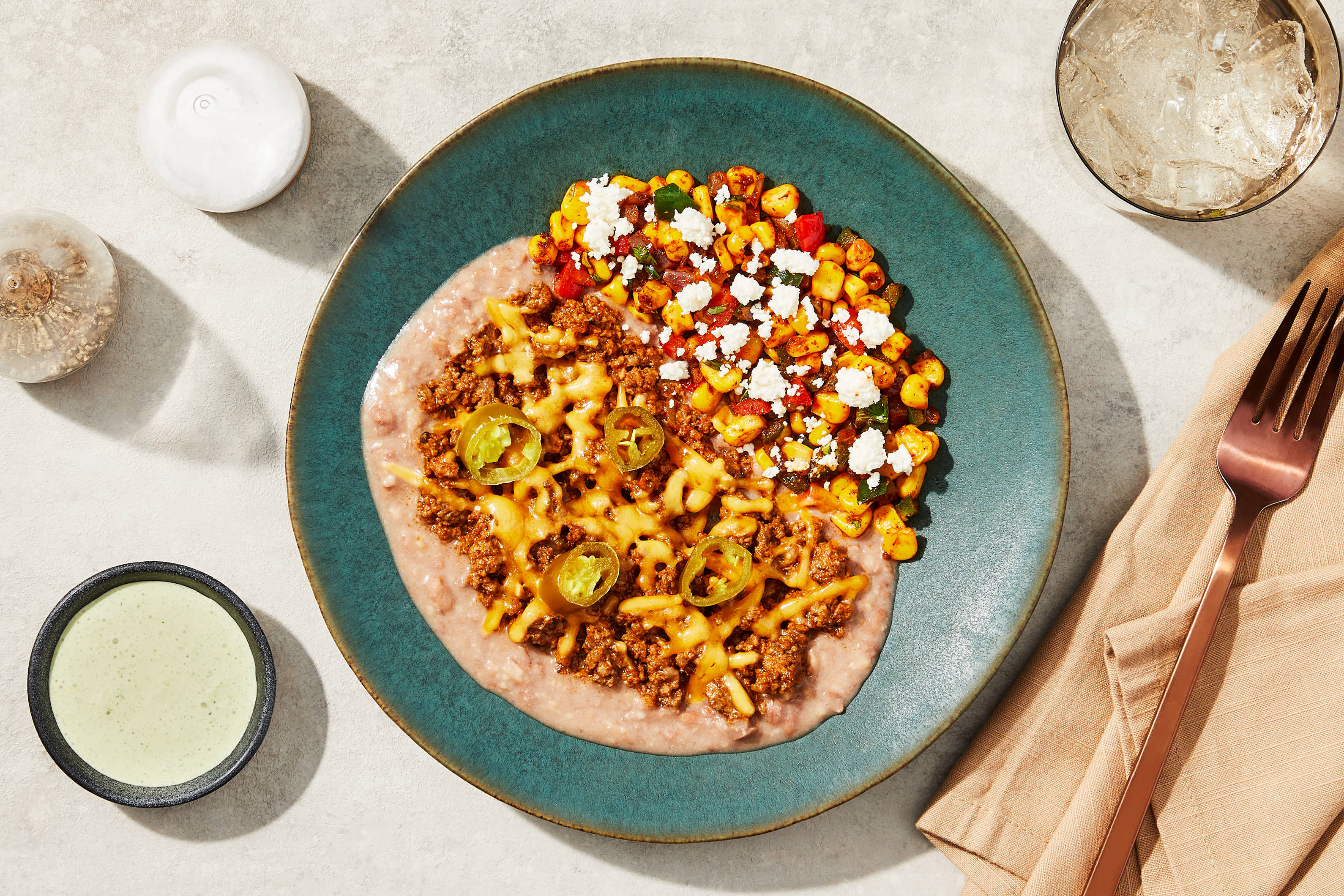 Mexican Beef & Refried Beans with Jalapeño-Cilantro Crema - Factor